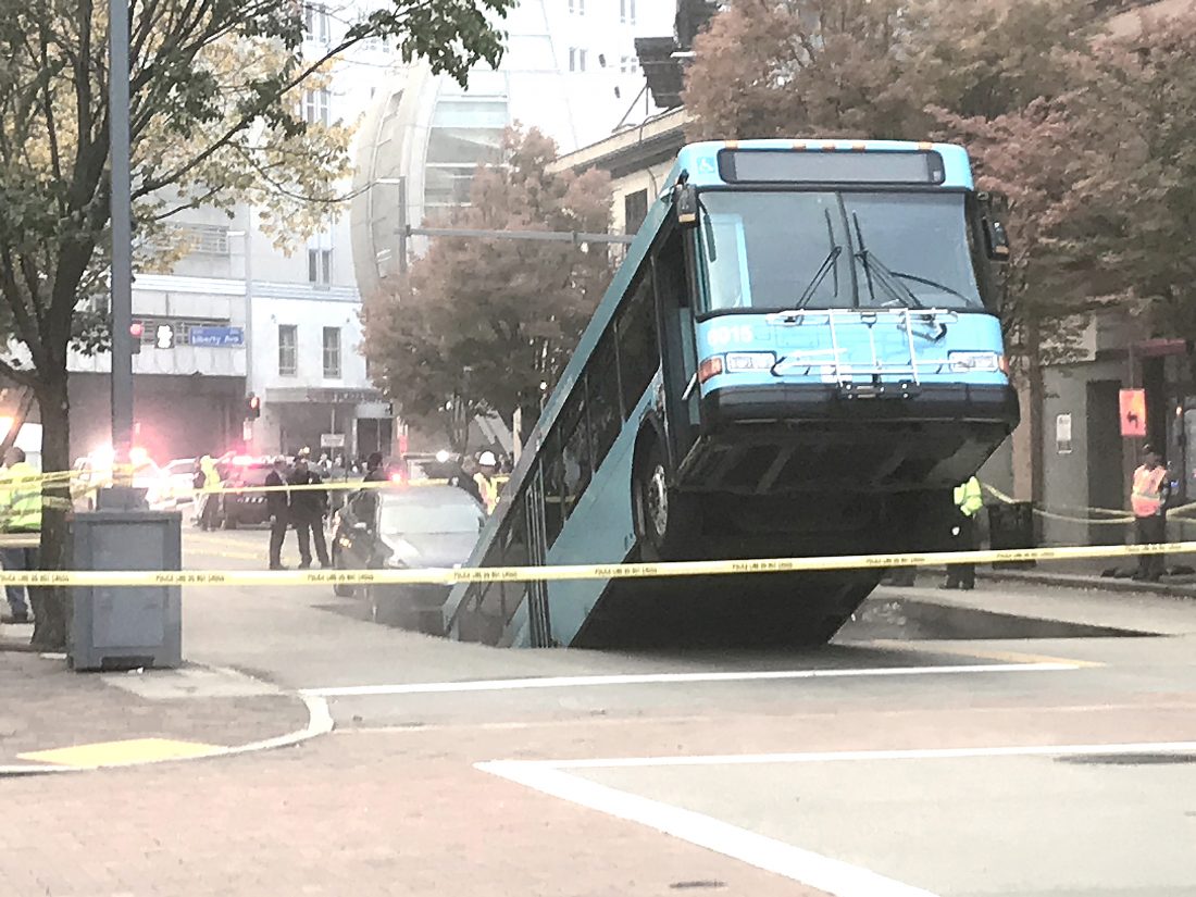 Sinkhole swallows Pittsburgh bus | News, Sports, Jobs - The Herald Star